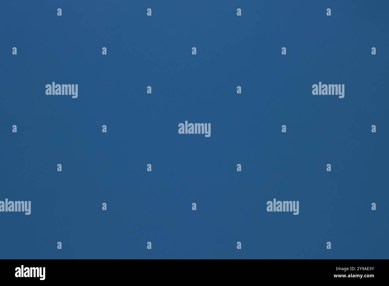 This paper background in dark blue color with a gradient texture ...