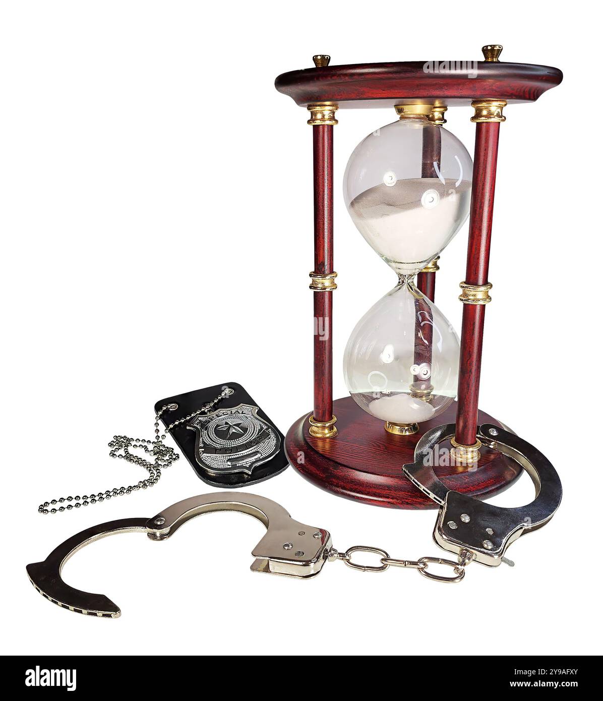 Old fashioned wood and glass hourglass for telling time with handcuffs ...
