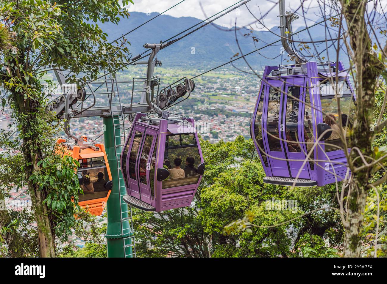 Cable car cabins with a panoramic view of Orizaba from Cerro del ...
