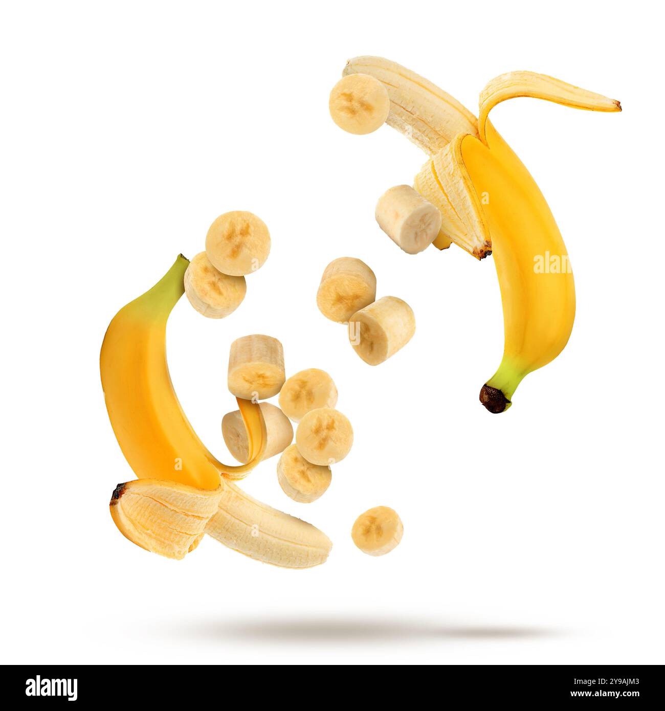 Fresh ripe bananas falling on white background Stock Photo - Alamy