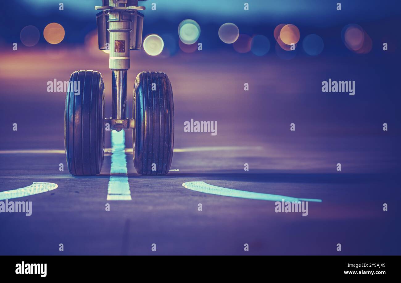 Airplane Wheels On The Runway Prior To Take-Off For A Red-Eye Flight At ...