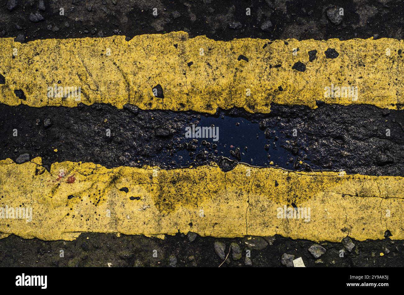 Grungy Double Yellow Line Road Markings On A British Street Stock Photo ...