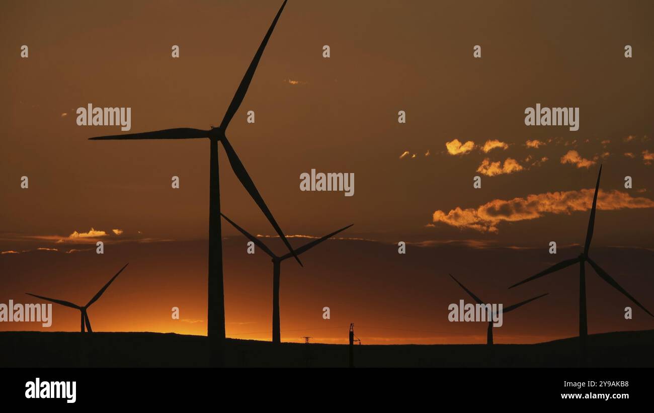 Beautiful sunrise dawn landscape with windmills or wind turbine on wind ...