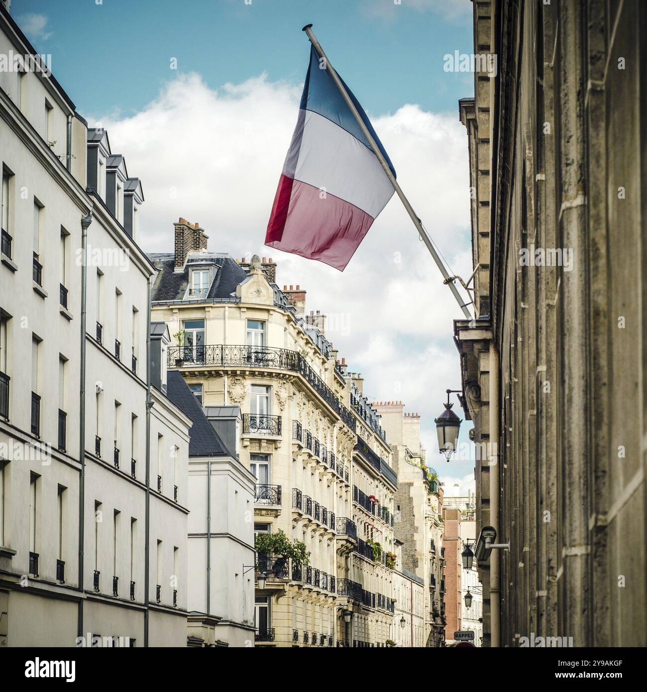 The French Flag Flying In A Residential Street In Paris Stock Photo - Alamy