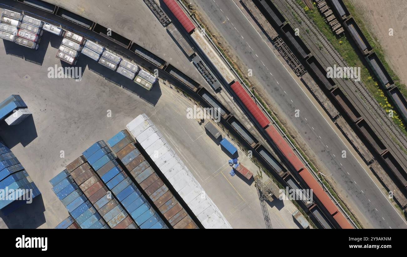 Aerial top view of cargo container terminal with railway, business ...
