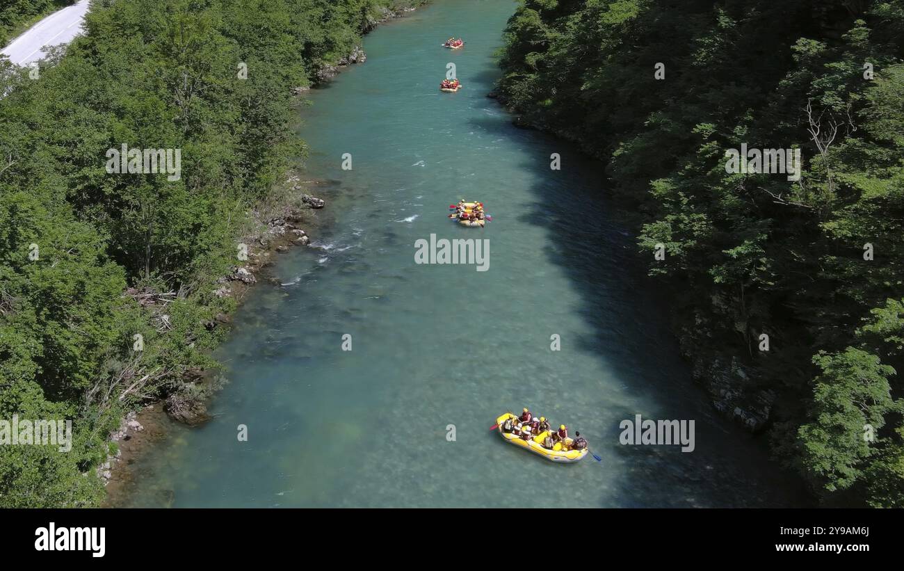 Aerial view of rafting boats on turquoise mountain river. Tara river ...