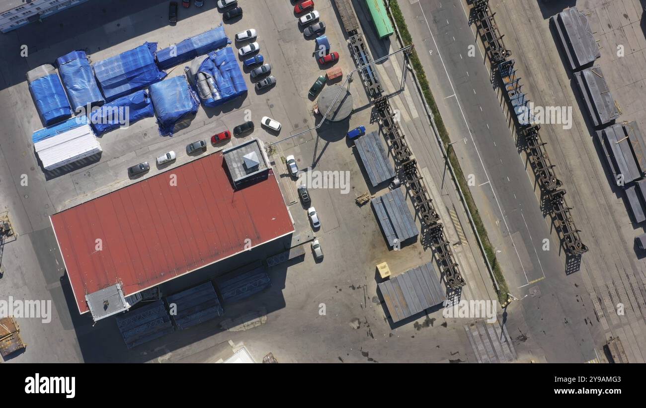 Aerial top view of cargo container terminal with railway, business ...