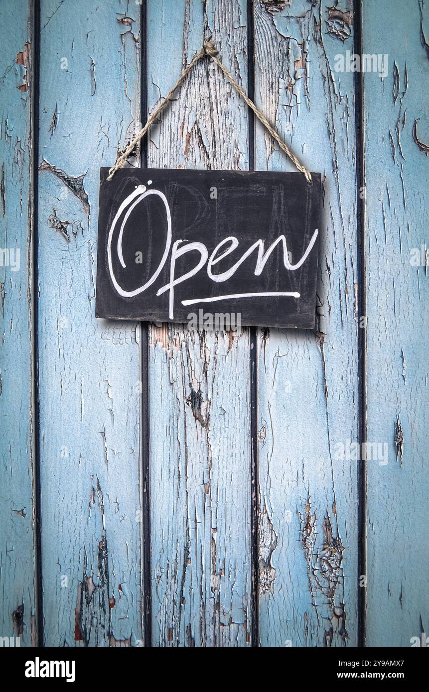 Rustic Hanging Open Sign On A Door With Peeling Blue Paint Stock Photo ...