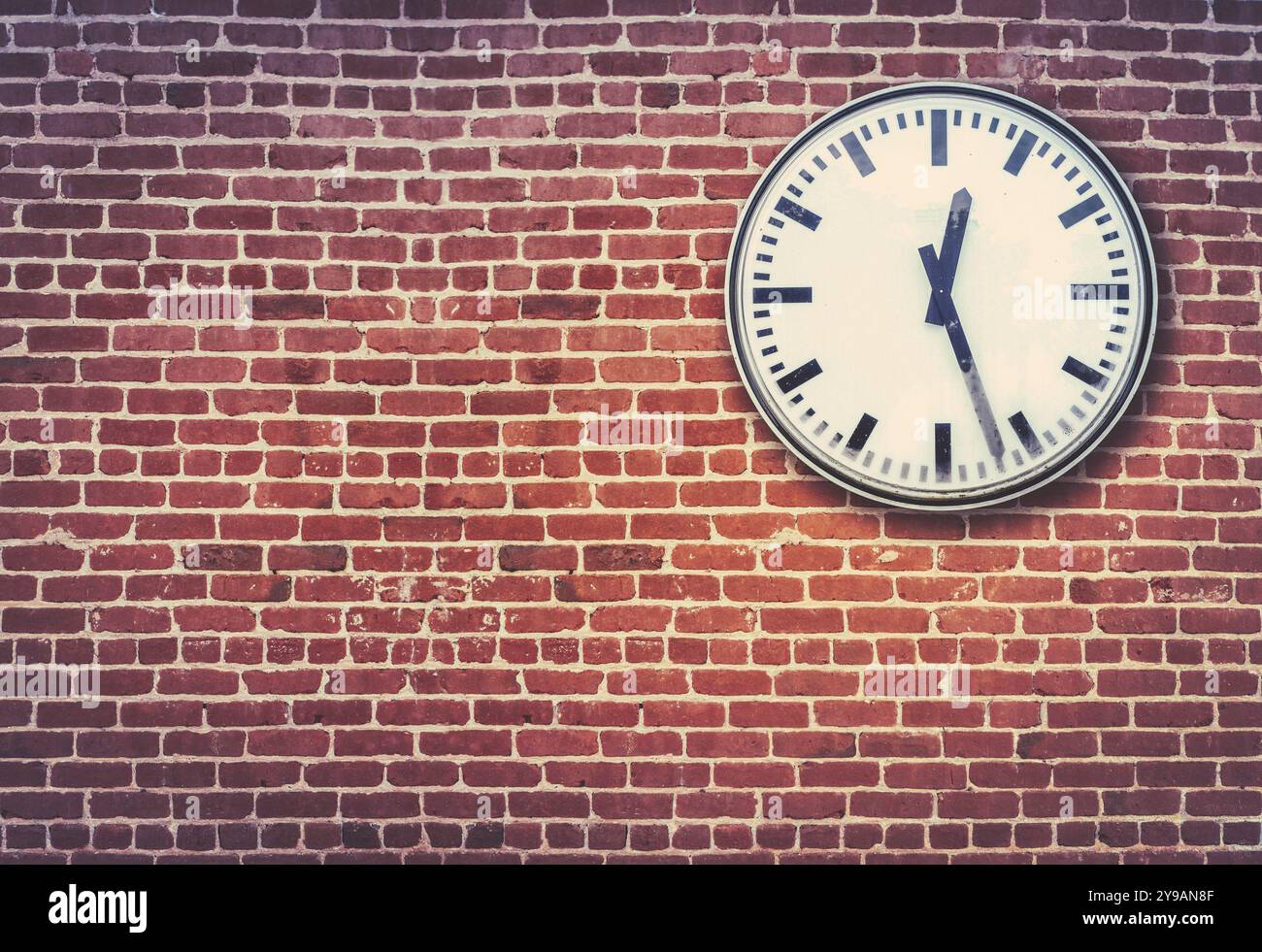 Retro Railway Style Clock Against A Red Brick Wall Stock Photo - Alamy