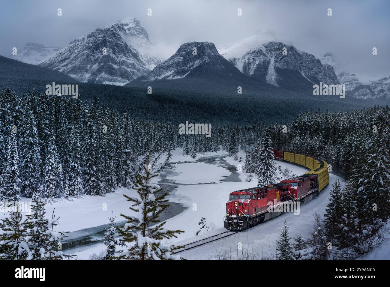 Winter in Banff national park at Morant's curve with a train coming ...