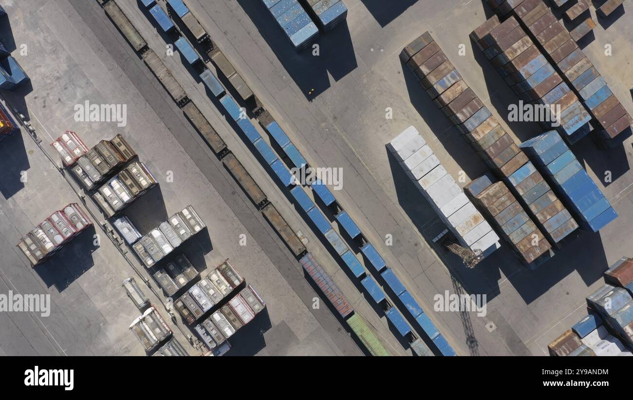 Aerial top view of cargo container terminal with railway, business ...