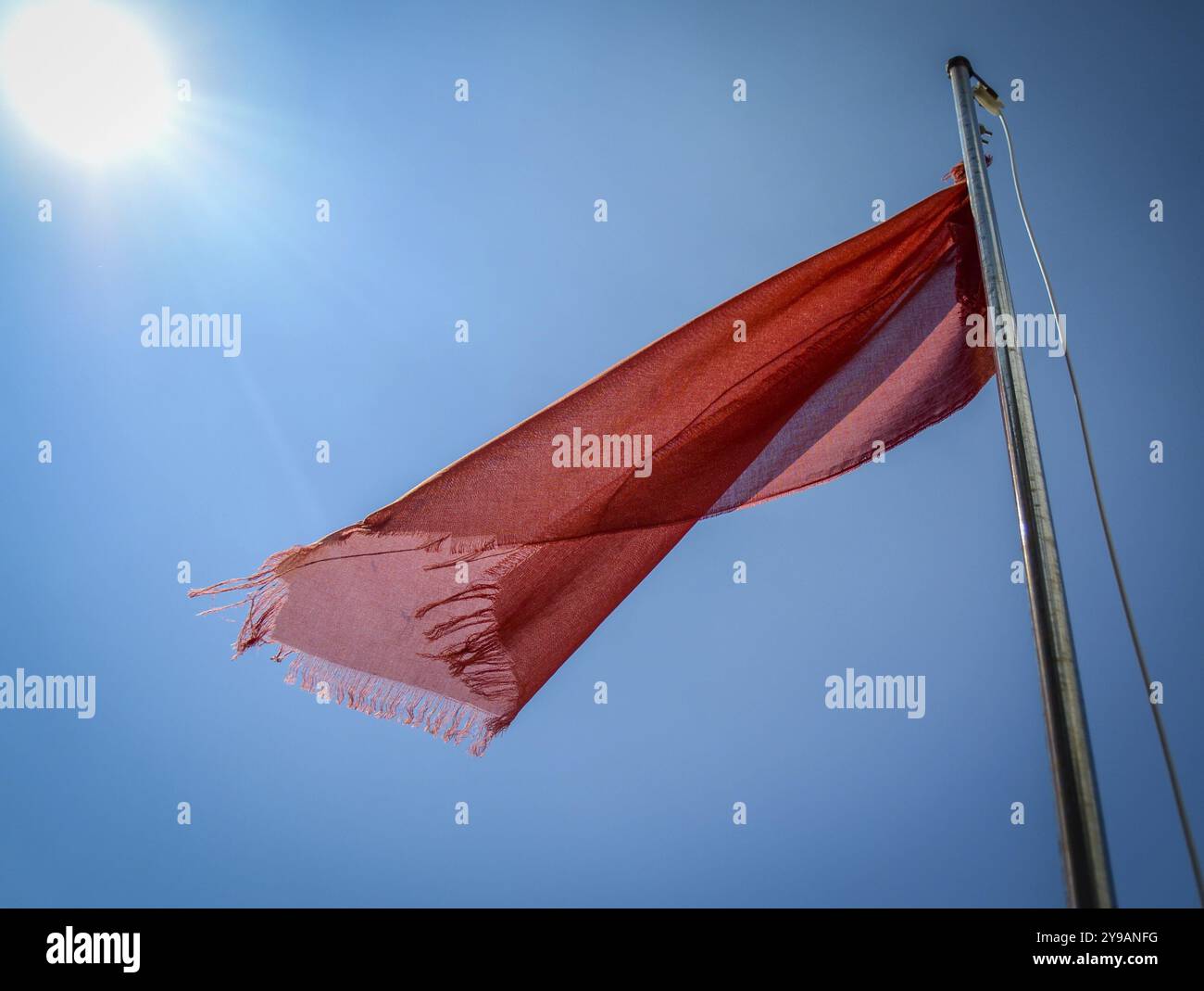 Red Flag At A Beach Warning Of Dangerous Currents Stock Photo - Alamy