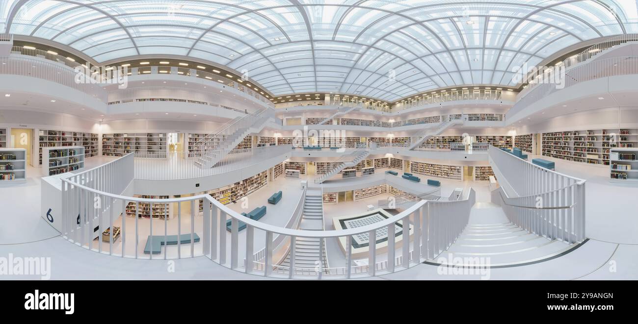 Galeriesaaal, Modern library with glass roof and white stairs, surrounded by bookshelves in a ...