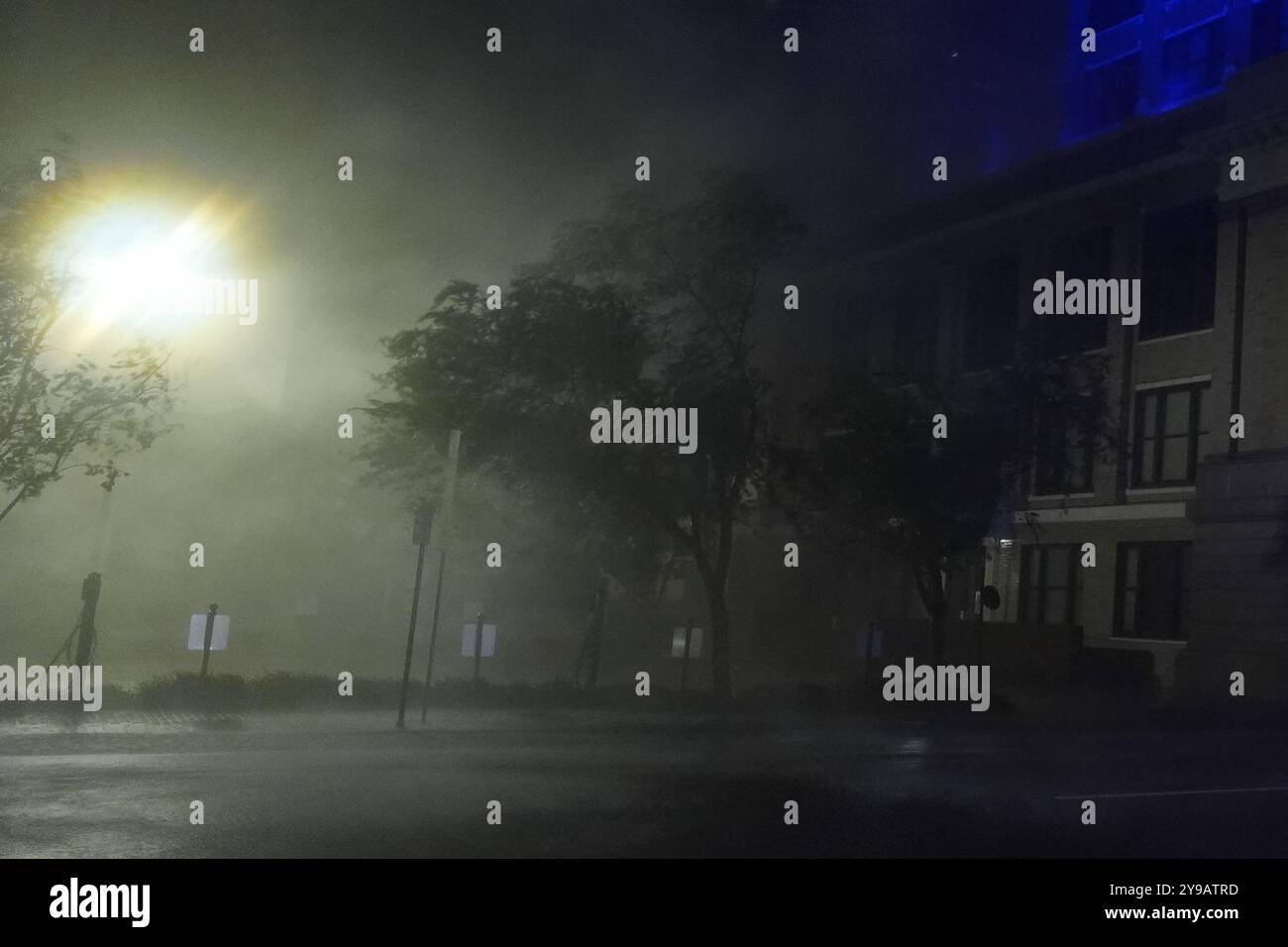Wind-driven rain soaks a street in downtown Tampa, Fla., during the ...