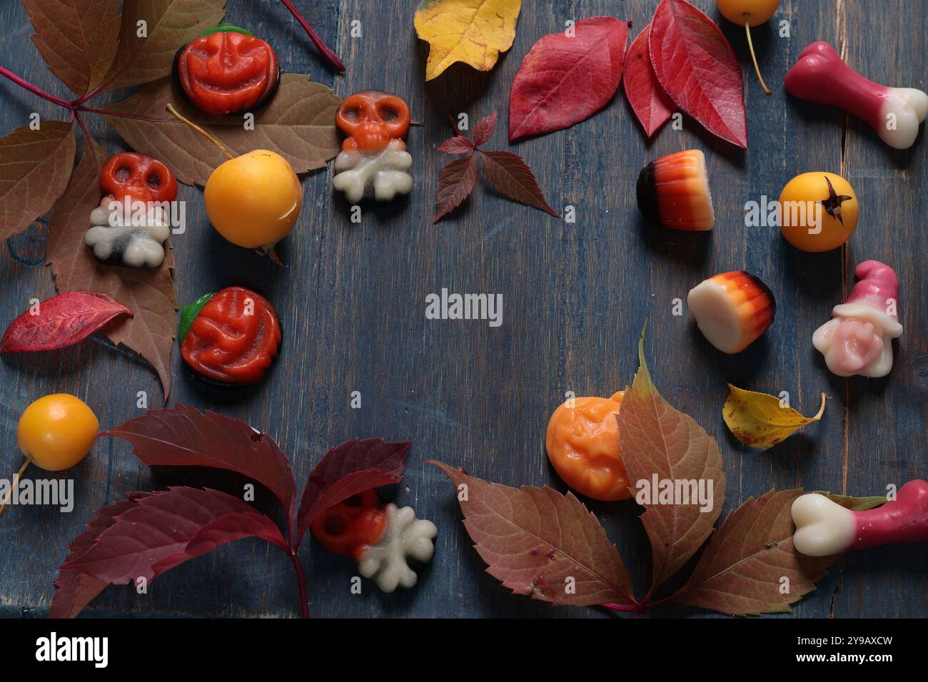 Frame of fall leaves, candy for Halloween. Holidays and food. Dessert ...
