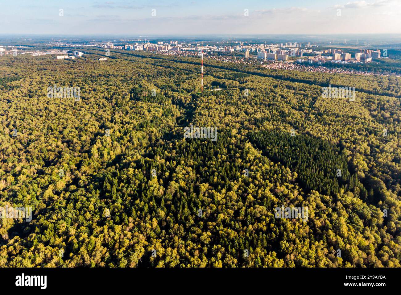 View from high altitude of urban development far beyond the forest ...