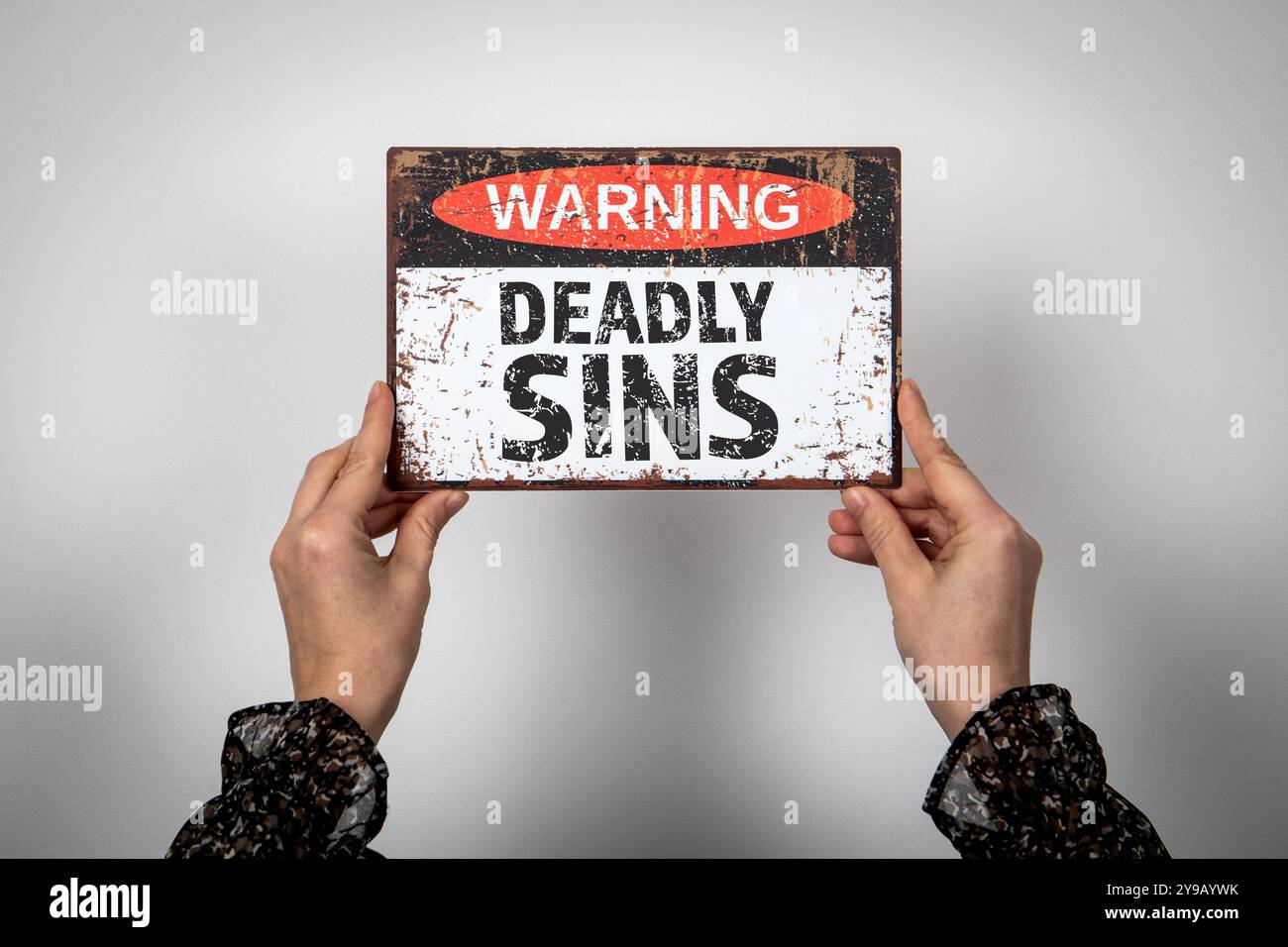 Deadly Sins. Warning sign with text on a white background Stock Photo ...