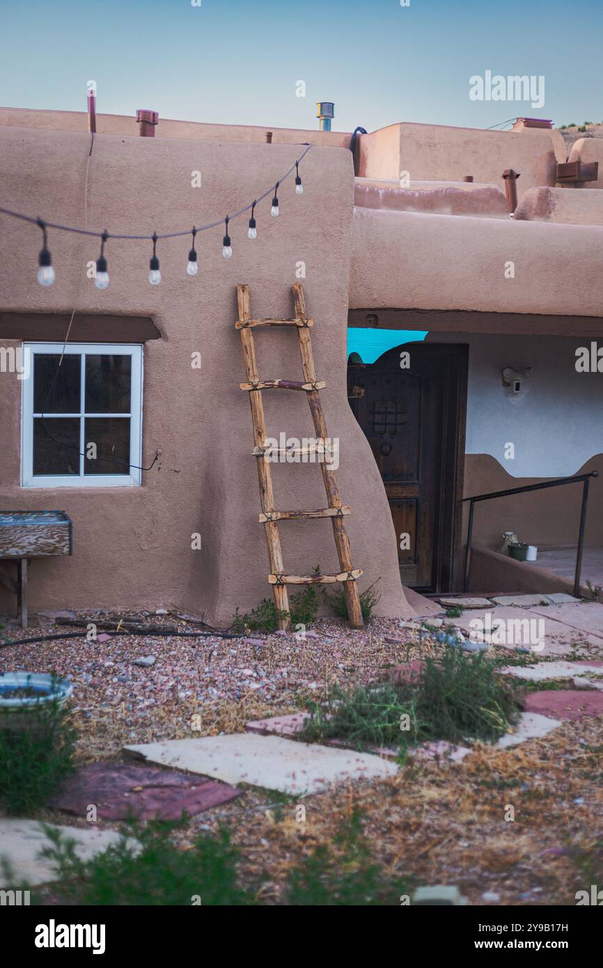 Adobe House with Wooden Ladder Stock Photo - Alamy