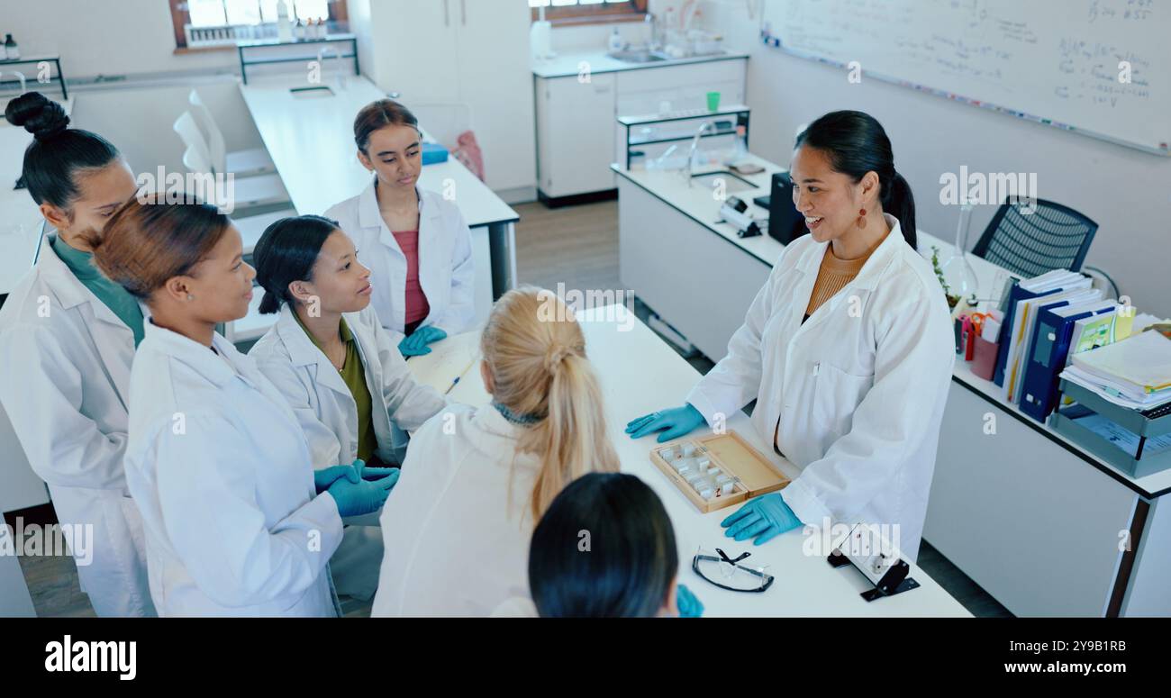 Science, laboratory and teacher with students in classroom for learning ...