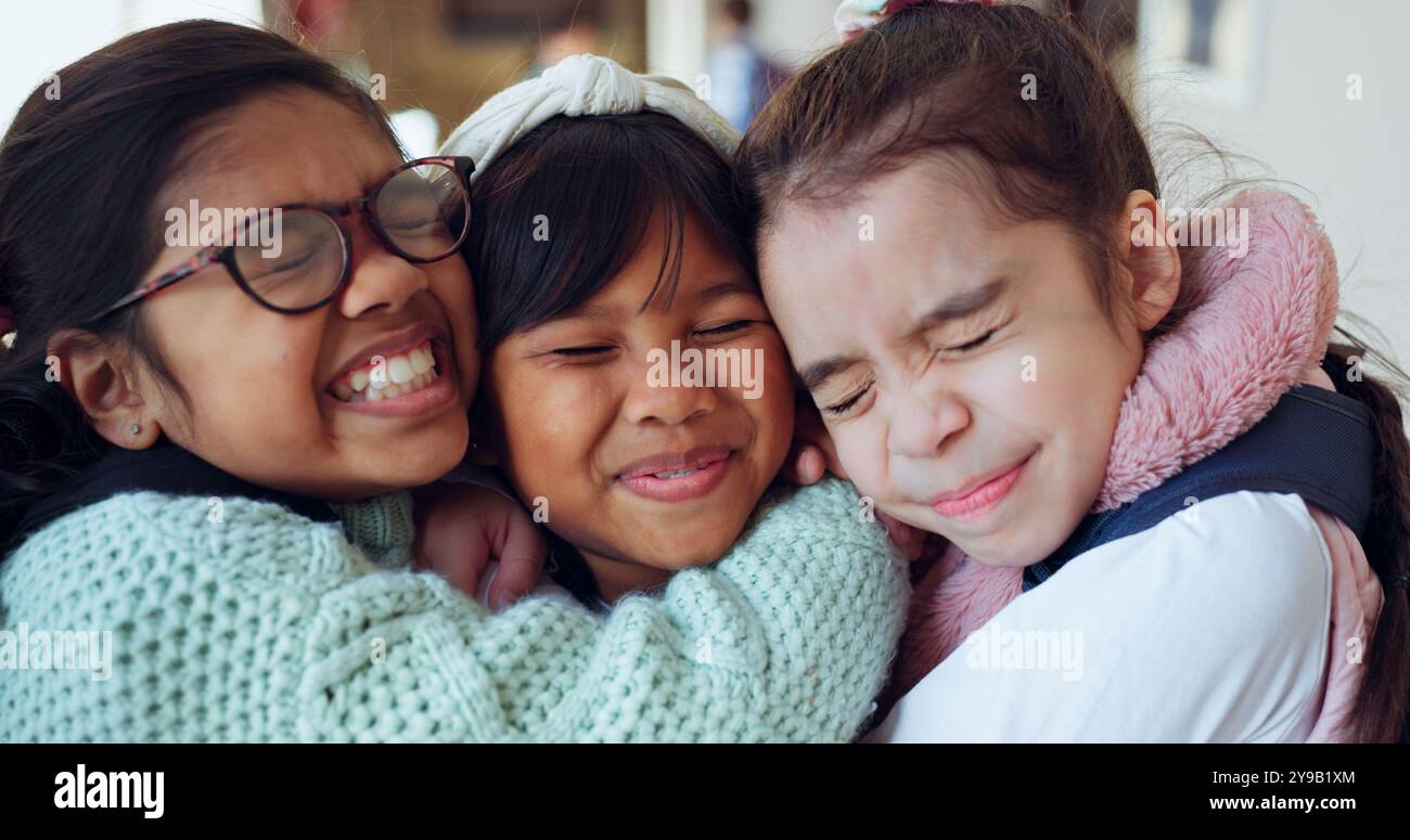 Children, excited and hug in class for friendship, reunion and ...