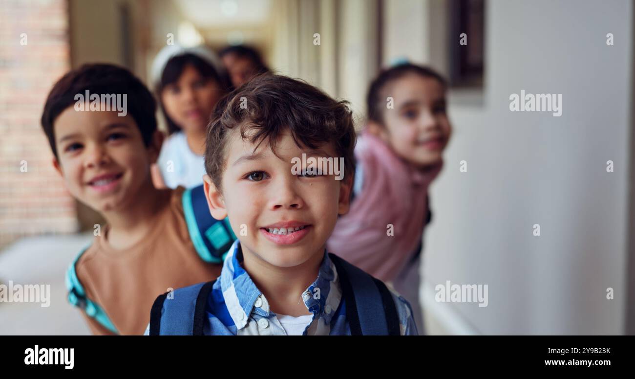 Hallway, portrait and boy with students, classroom and education with ...