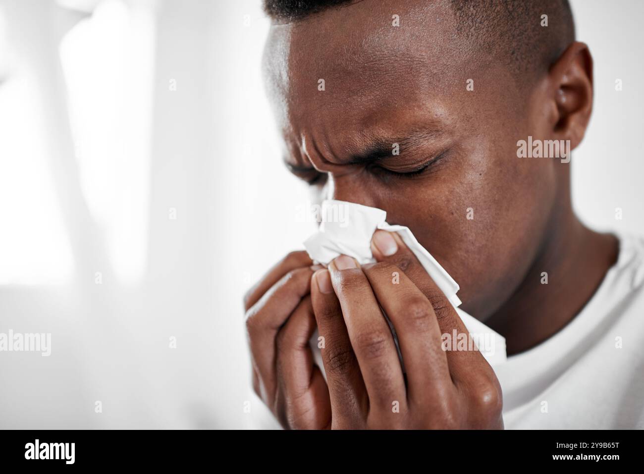 Sick, sneeze and black man with tissue in home with sickness for hay ...