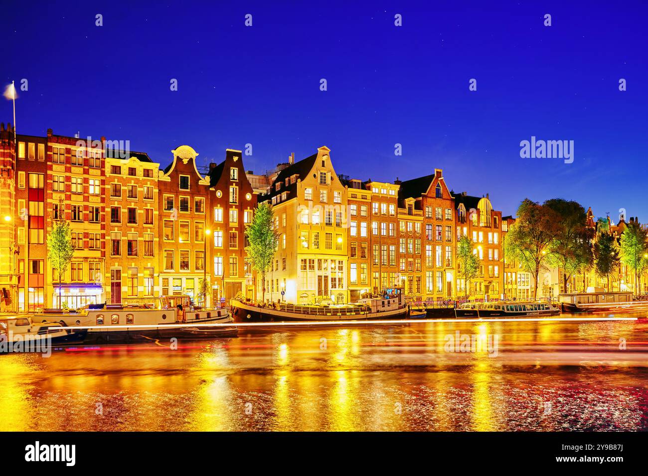 Famous Amstel river and night view of beautiful Amsterdam city ...