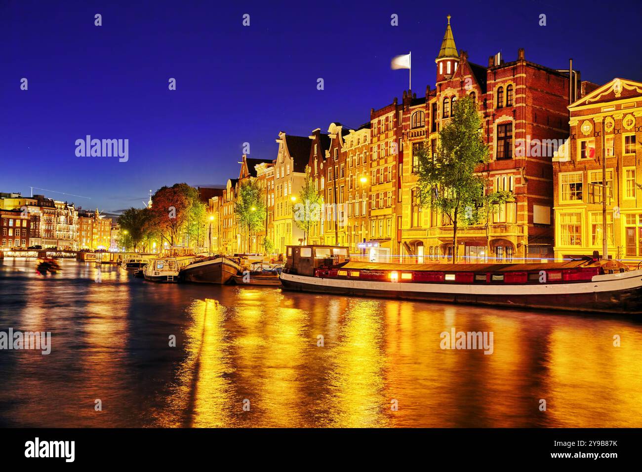 Famous Amstel river and night view of beautiful Amsterdam city ...
