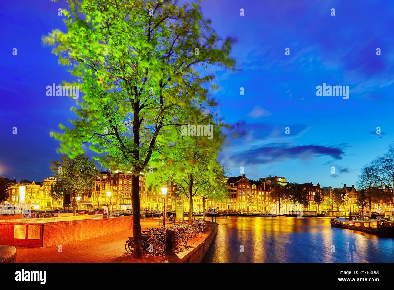 Famous Amstel river and night view of beautiful Amsterdam city ...
