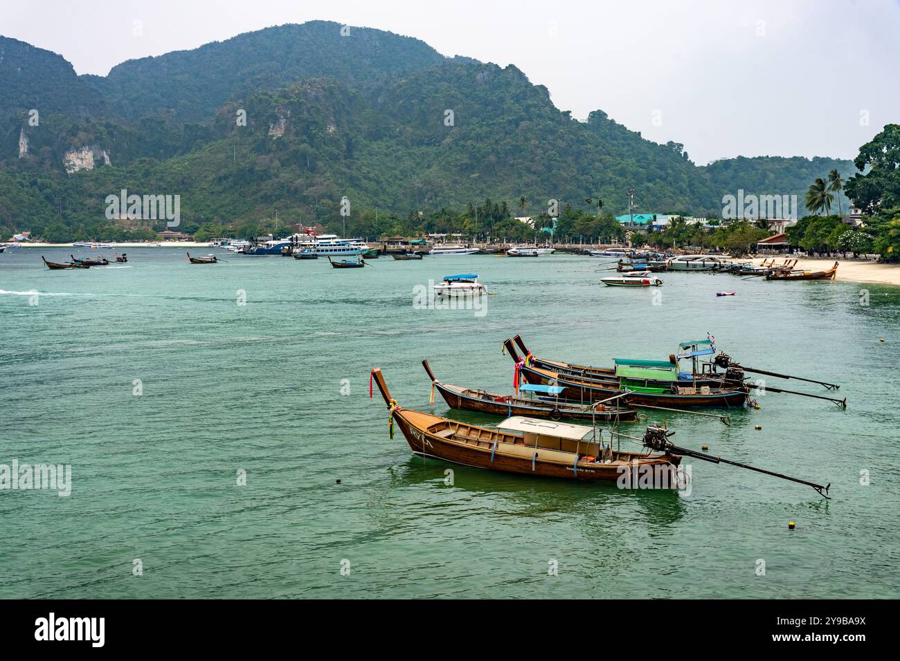 Tourist sea port shore with lots of boats in Asia Stock Photo - Alamy