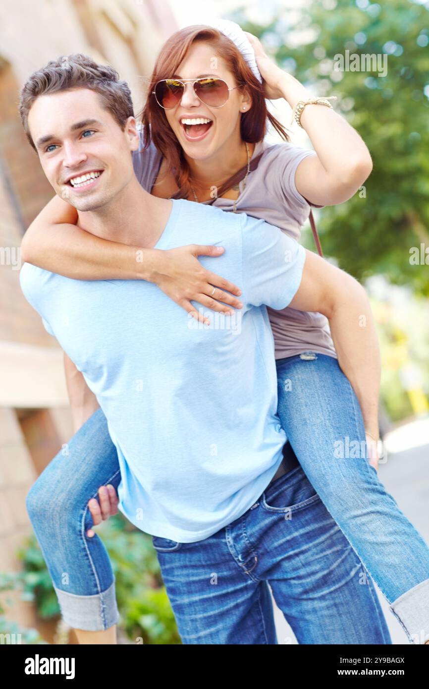 Love, excited couple and piggyback outdoor for connection, travel and ...