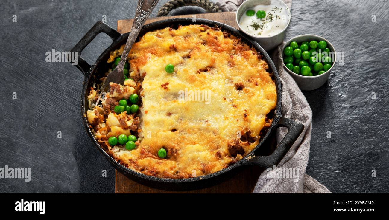 Shepherd's Pie with ground beef, potato and cheese on black background ... Shepherd's Pie with ground beef, potato and cheese on black background ...