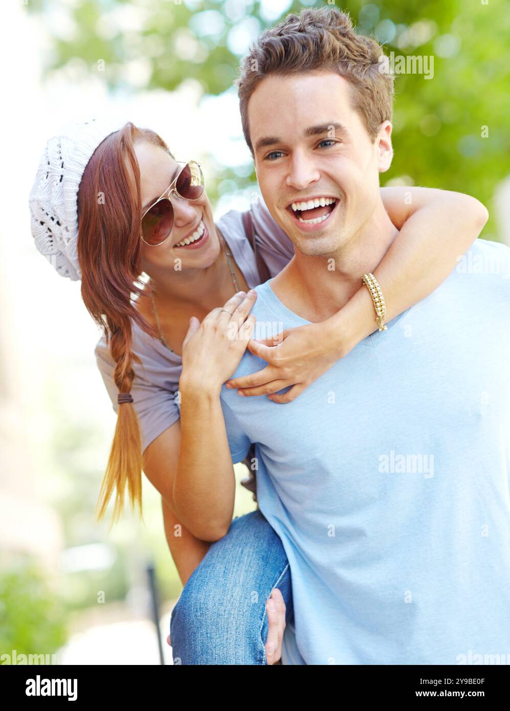Support, couple laughing and piggyback at park for connection ...