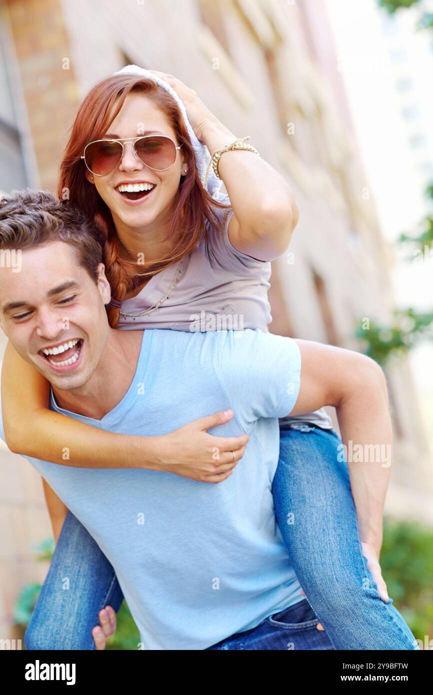 Travel, couple laughing and piggyback in city for connection, love and ...