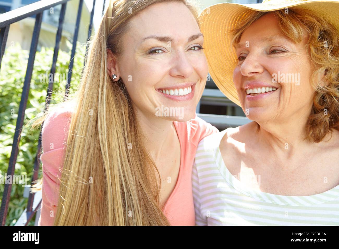 Stairs, senior mother and daughter with smile for love, support and ...