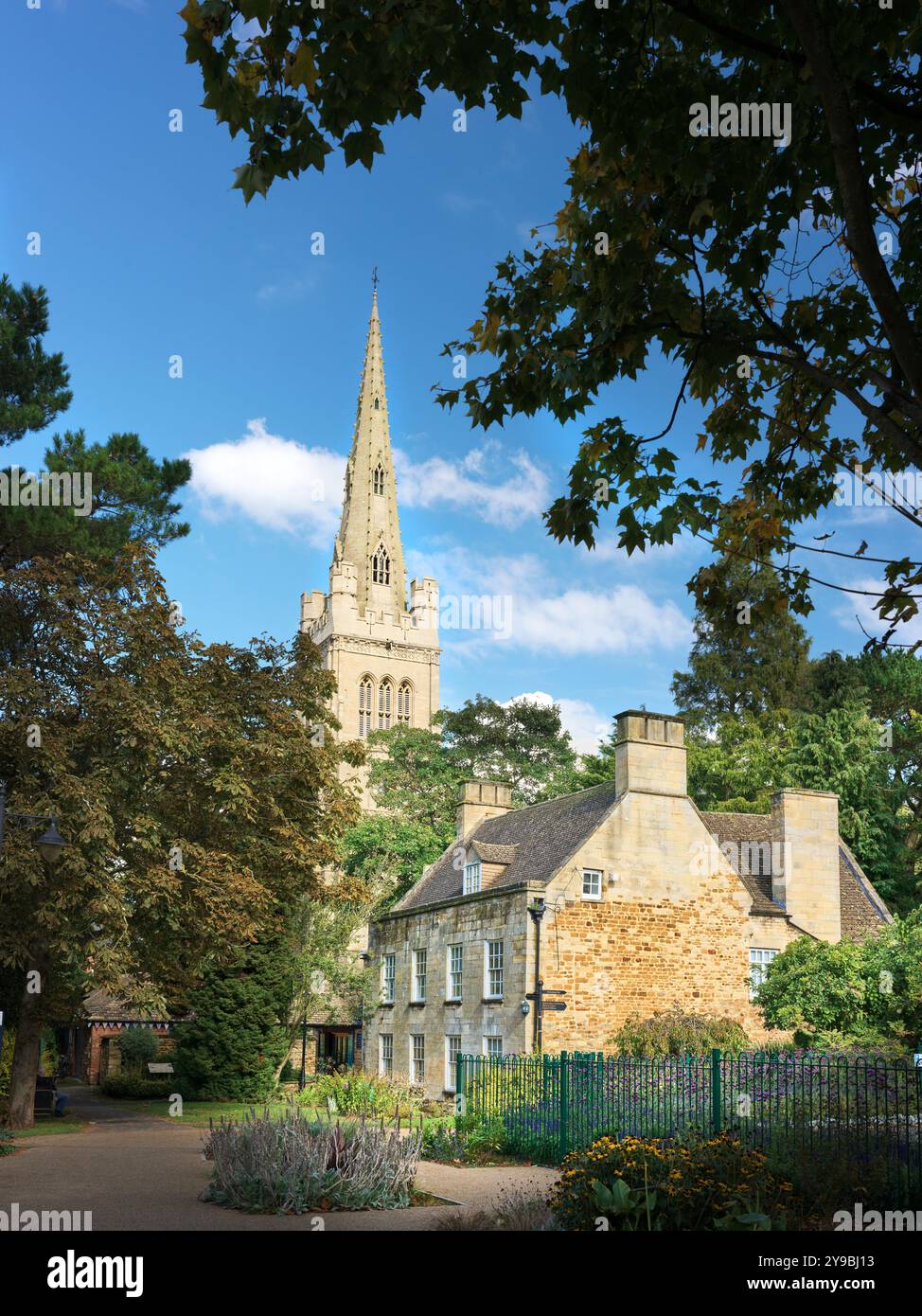 Manor House museum with the tower and spire of Saints Peter and Paul ...