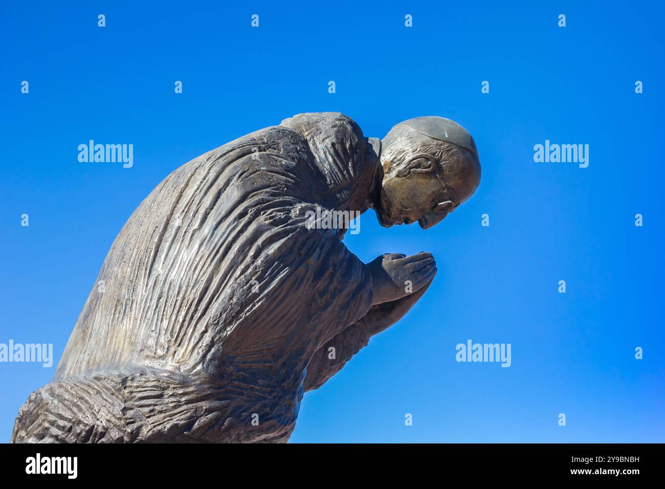 Statue of a monk bowing at the Santuario de Cristo Rei in Lisbon ...