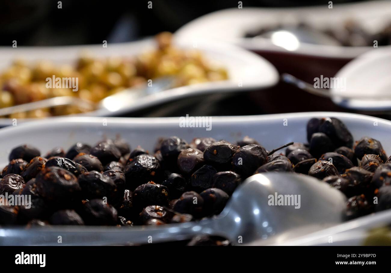 Black olives on finger hi-res stock photography and images - Alamy