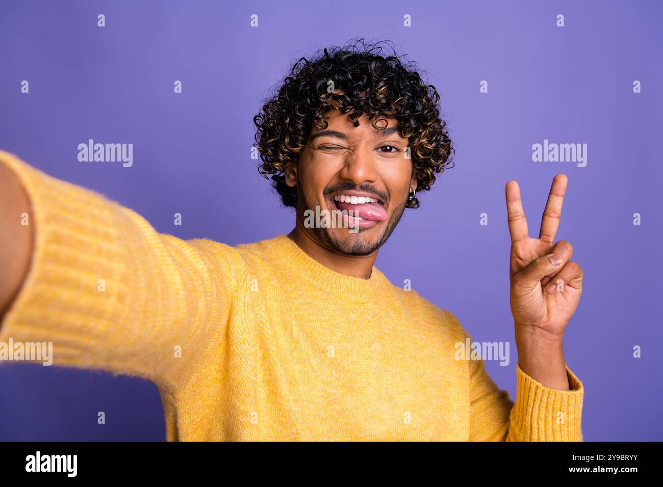 Photo of positive cheerful blogger man wear stylish clothes make video ...