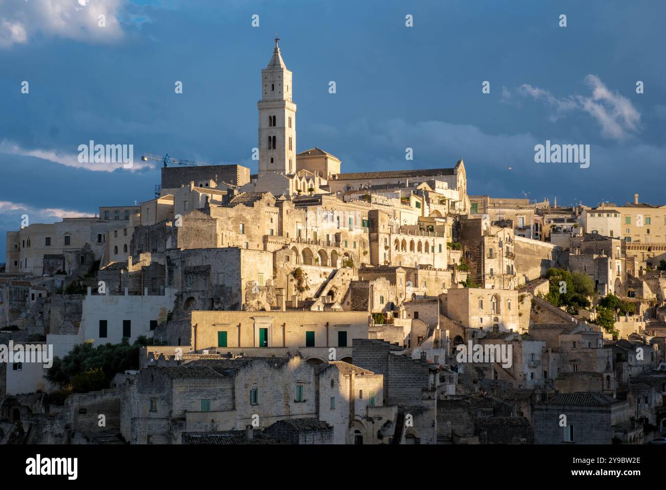 In the enchanting city of Matera, Puglia Italy, ancient stone buildings ...