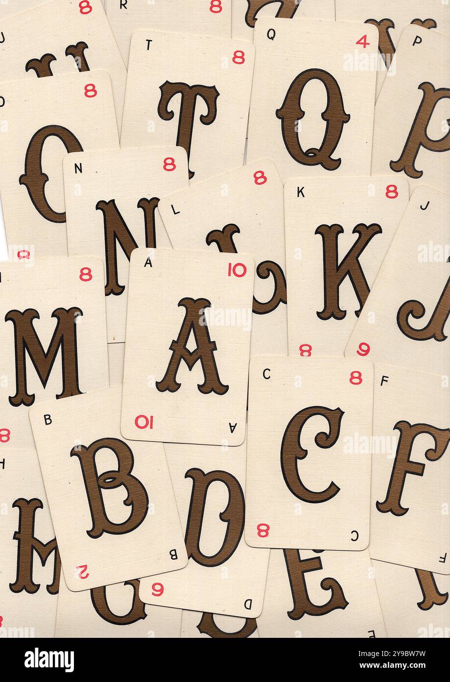 A montage of vintage playing cards with ornate capital letters from the ...