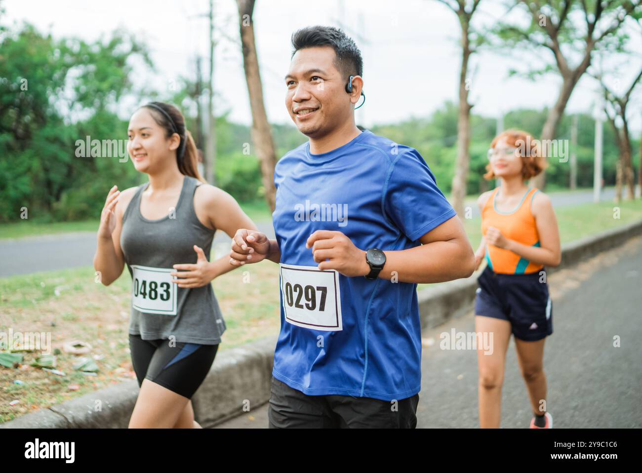 male runner running on marathon track Stock Photo - Alamy