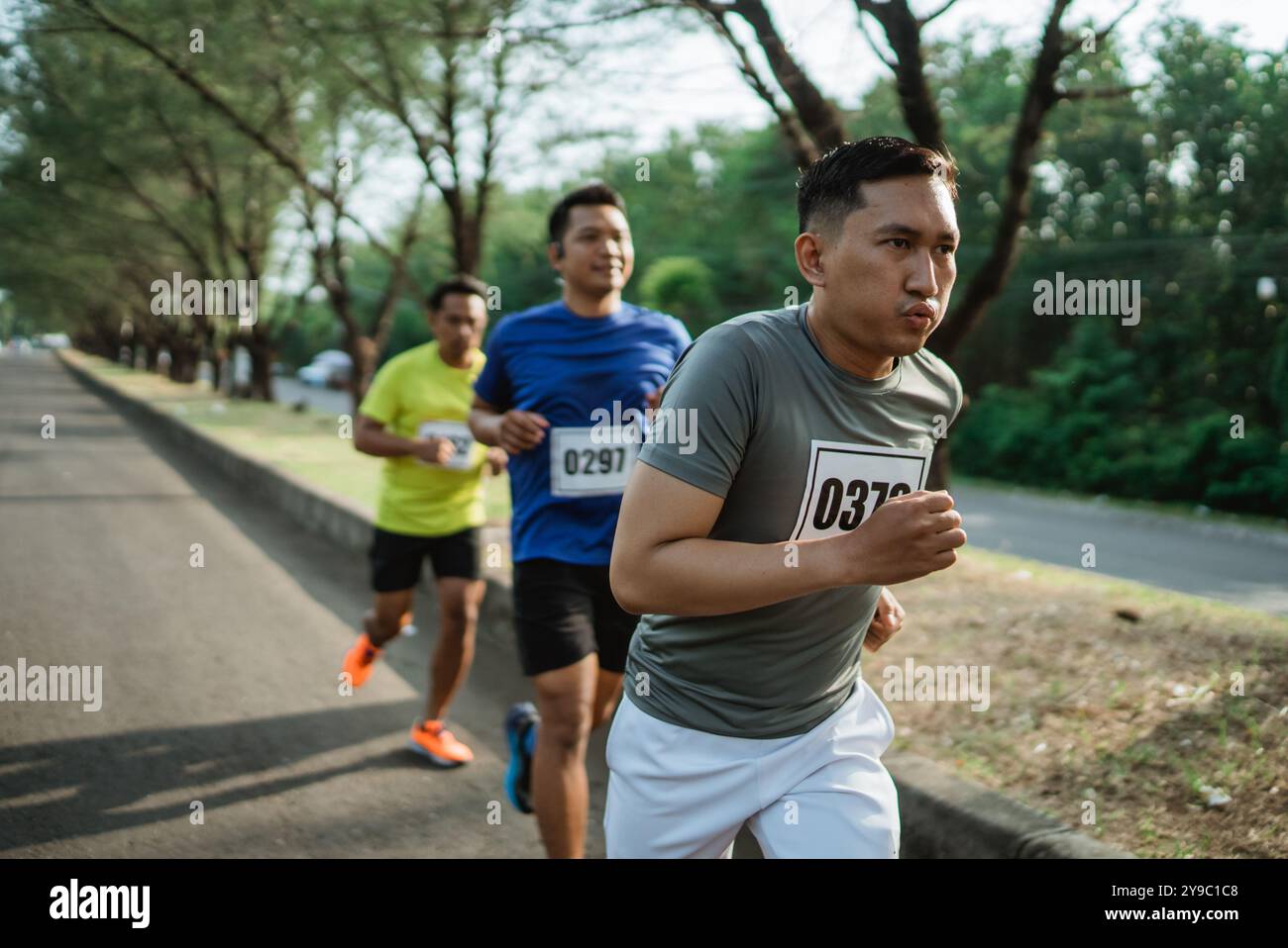 asian male athlete running marathon track Stock Photo - Alamy