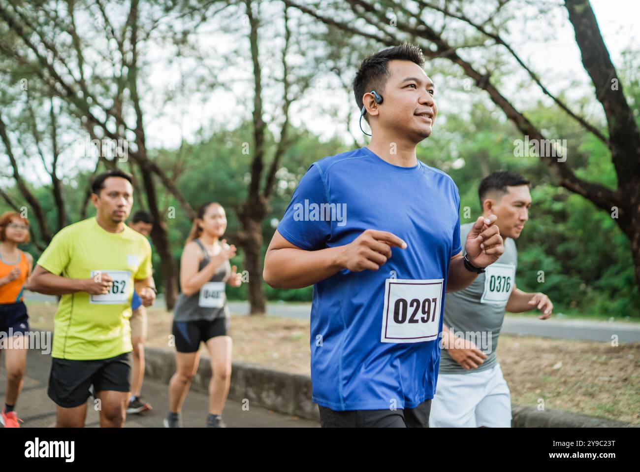 asian male running at marathon event Stock Photo - Alamy