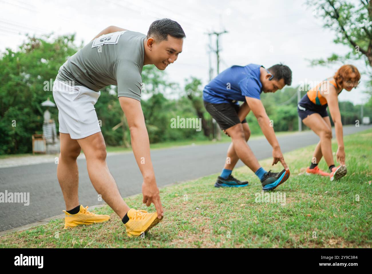 athletic male stretching before running Stock Photo - Alamy