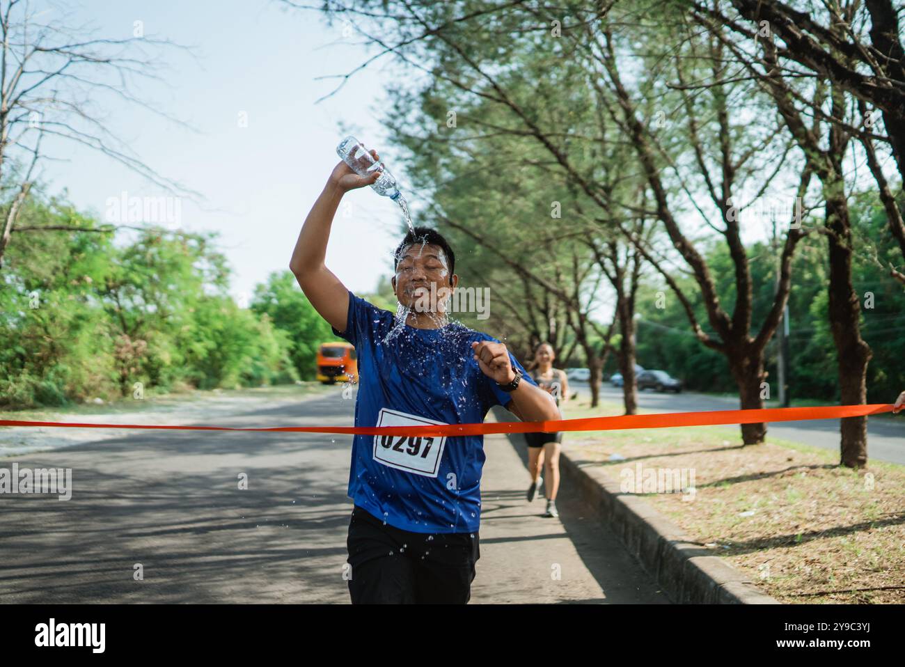 male runner almost crossing finish line Stock Photo - Alamy