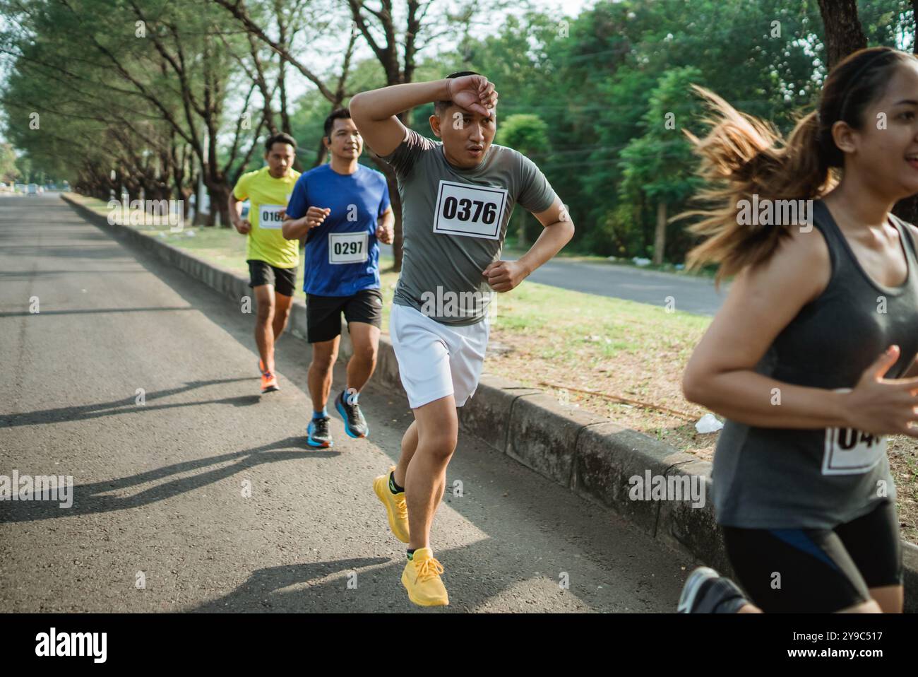 female runner participating on marathon event Stock Photo - Alamy