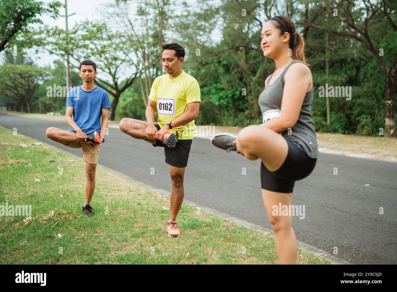 female runner warming up before marathon Stock Photo - Alamy