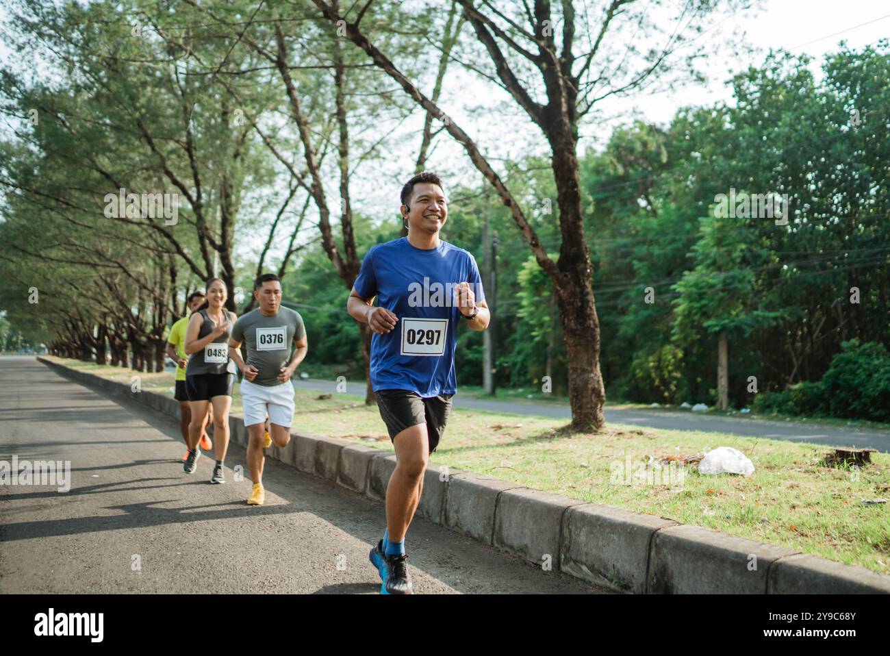 asian male athlete running marathon track Stock Photo - Alamy