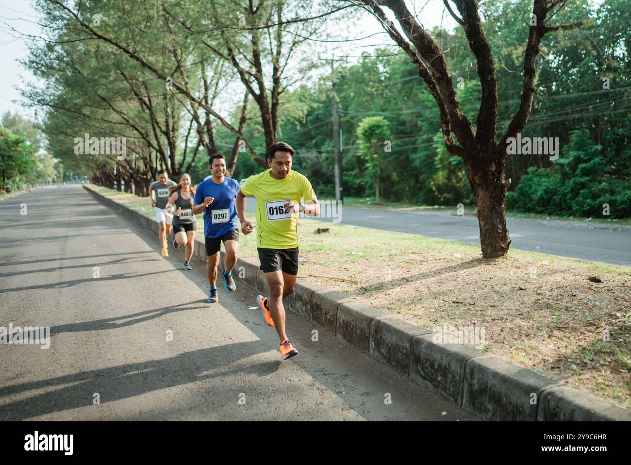 marathon runners running on the road Stock Photo - Alamy